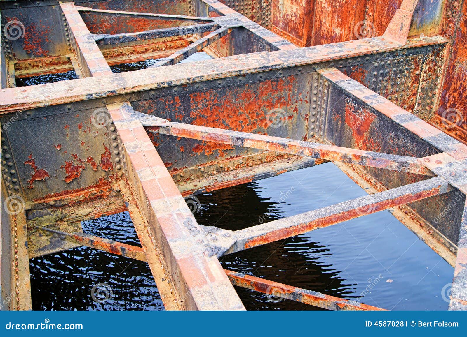 Rusted Bridge Girders Over Water Stock Image - Image of water, bolts ...