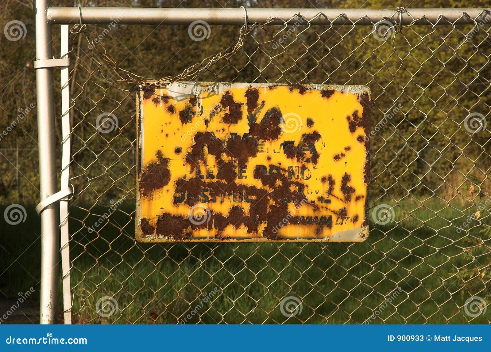 Rusted Fence Sign stock image. Image of message, yellow - 900933