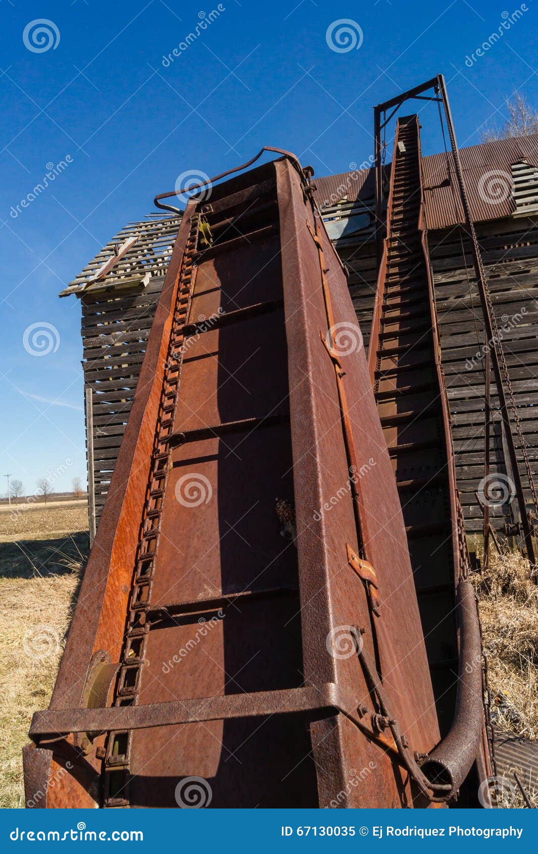 Rusted grain conveyor. stock image. Image of farm, front - 67130035