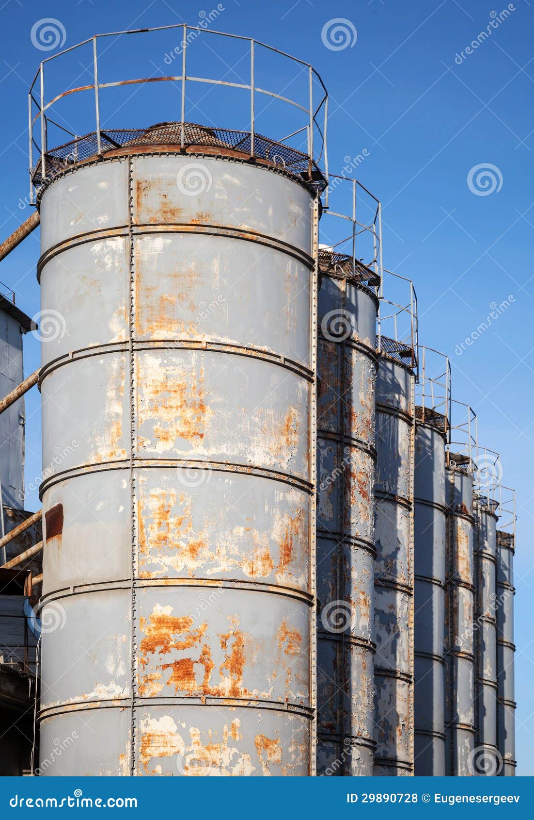 Rusted gray tall tanks stock photo. Image of reserve - 29890728