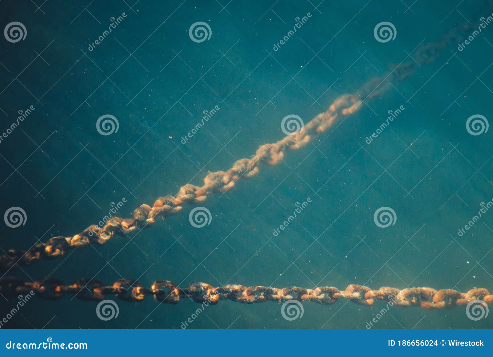 Rusted Metal Chains in the Water with Sunlight on it Stock Photo ...
