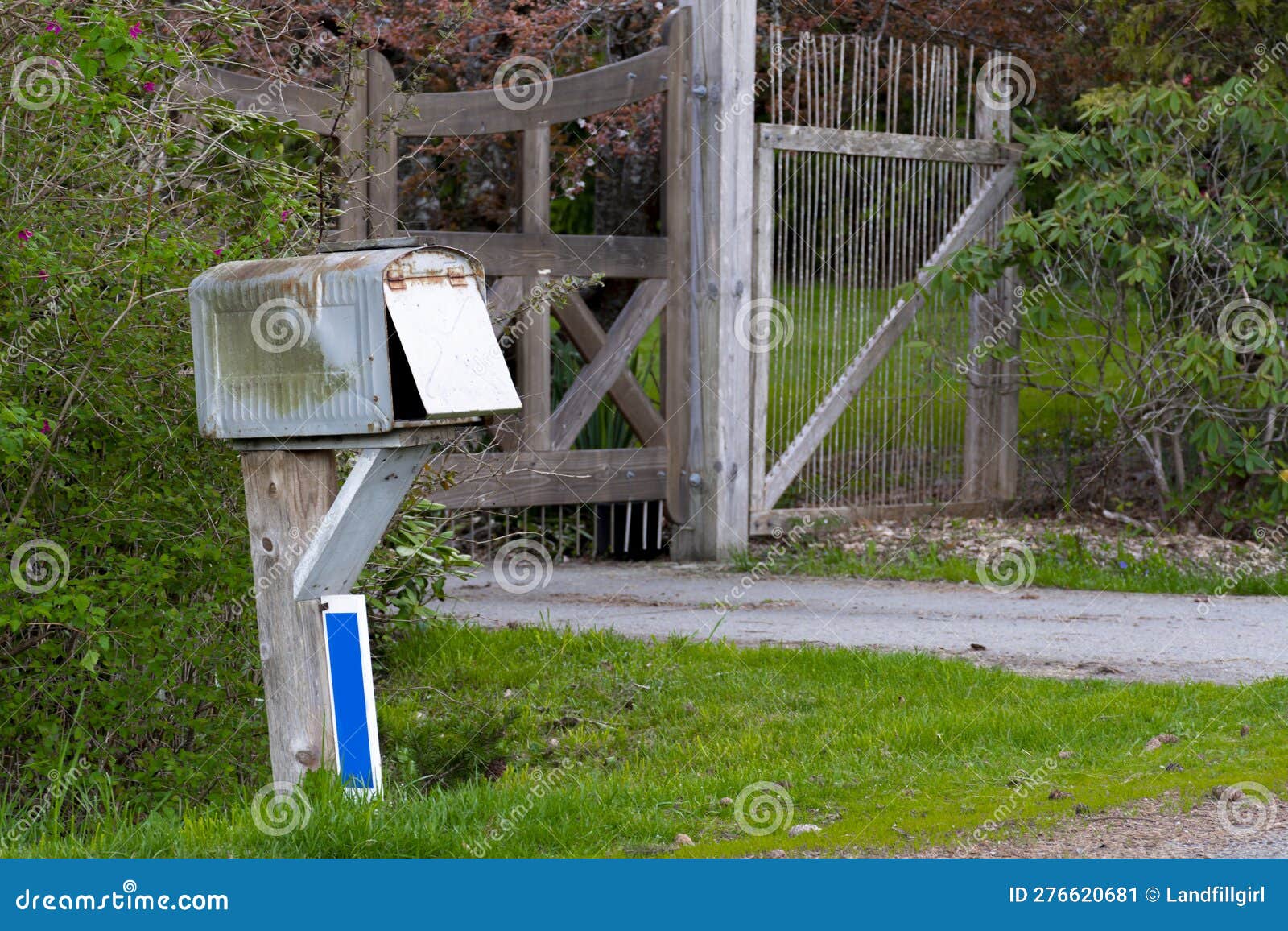 Rusted Metal Mailbox and Wooden Gate Stock Image - Image of gate, field ...