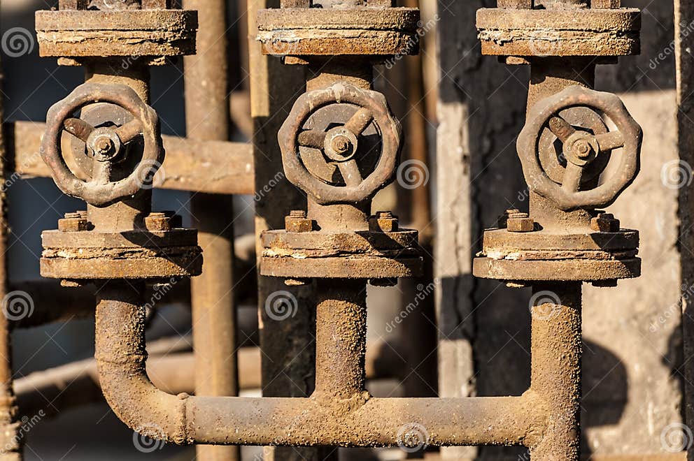 Rusted valves and pipes stock photo. Image of factory - 32392360