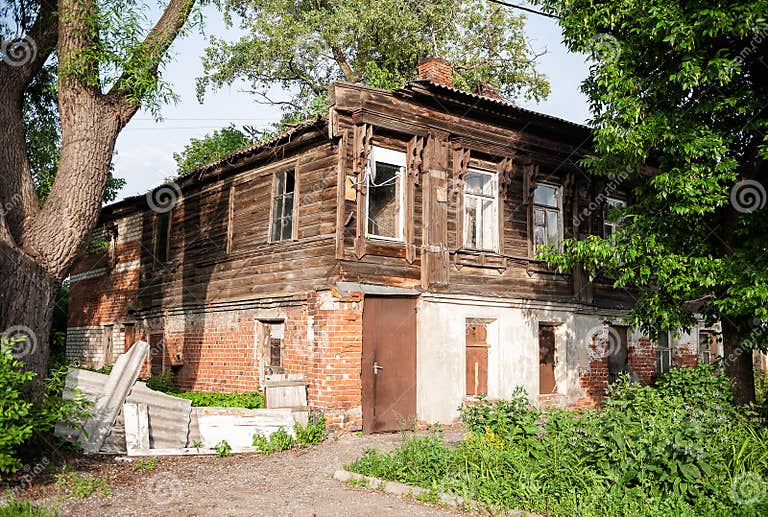Rustic, Abandoned House with a Deteriorating Facade and Broken Windows ...