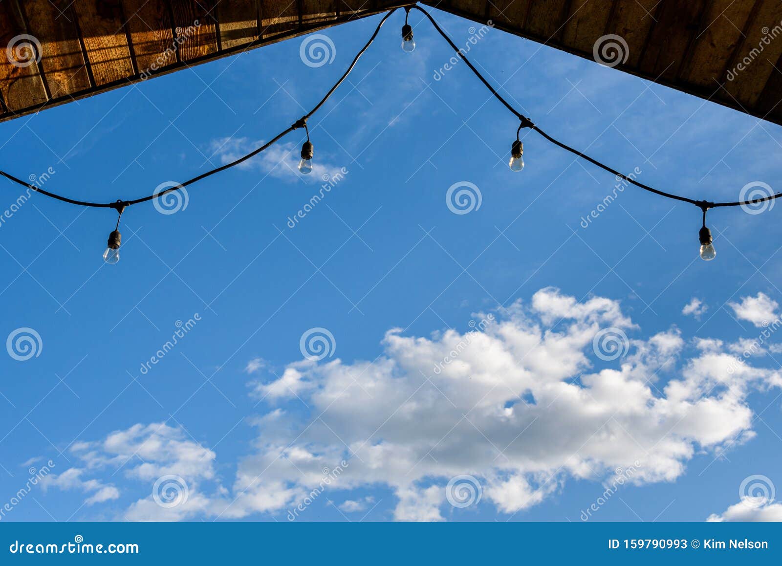 Rustic Background of Outdoor Wood Ceiling and String of Lights Framing ...