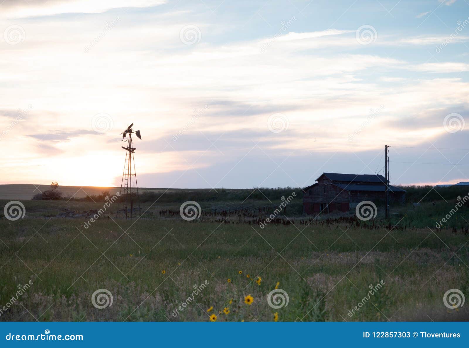 A Rustic Barn and Wildmill at Sunset Stock Image - Image of horizontal ...