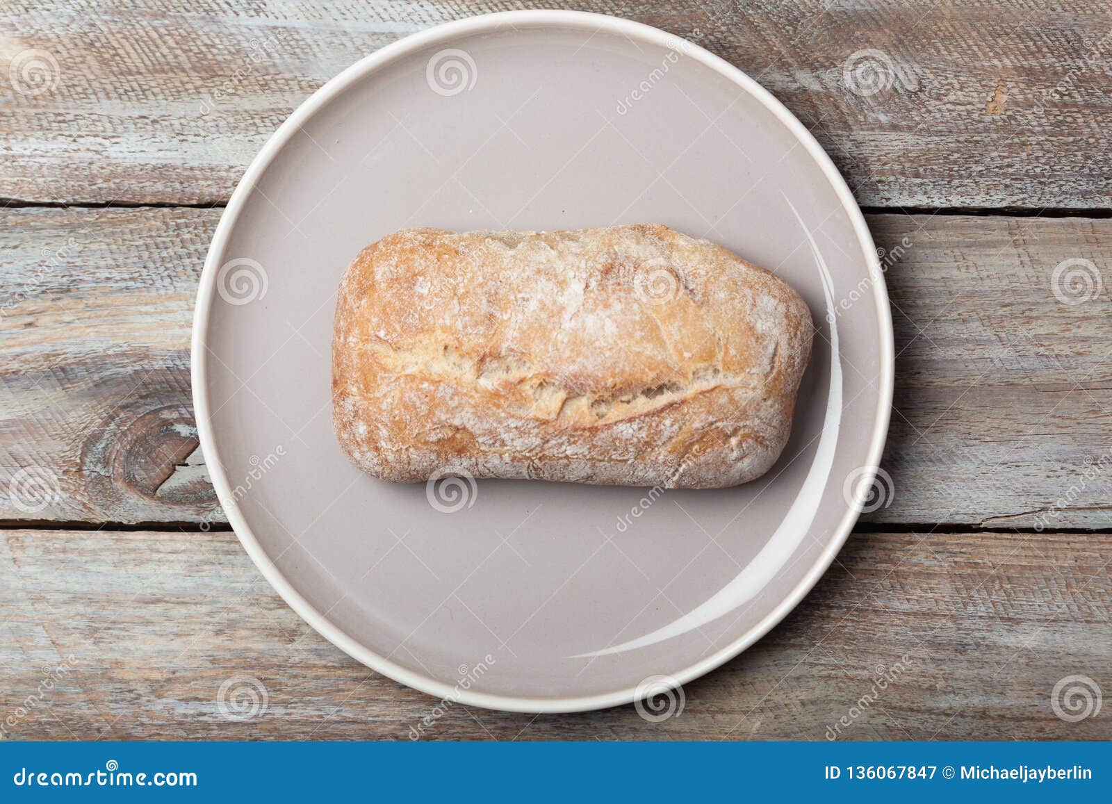 Rustic bread roll on plate stock image. Image of food - 136067847