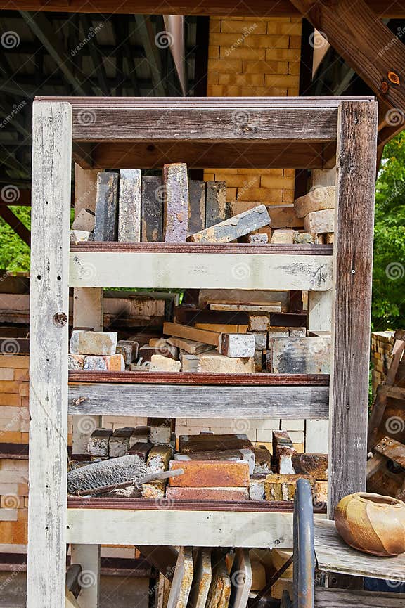 Rustic Brick Collection and Tools on Weathered Rack - Construction ...