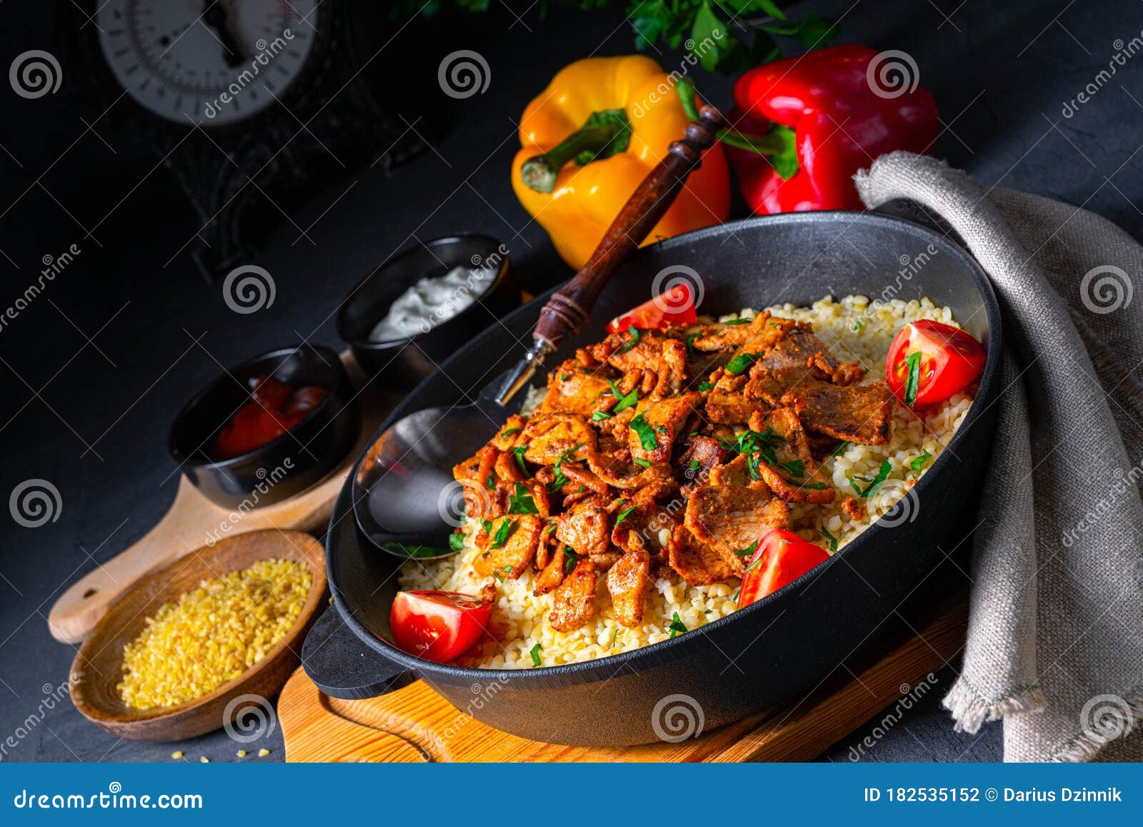 Rustic Bulgur Pans with Gratinated Gyros and Yoghurt Stock Photo ...