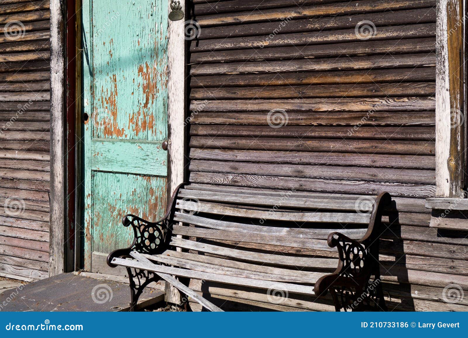 Neglected cabin and bench stock photo. Image of home - 210733186