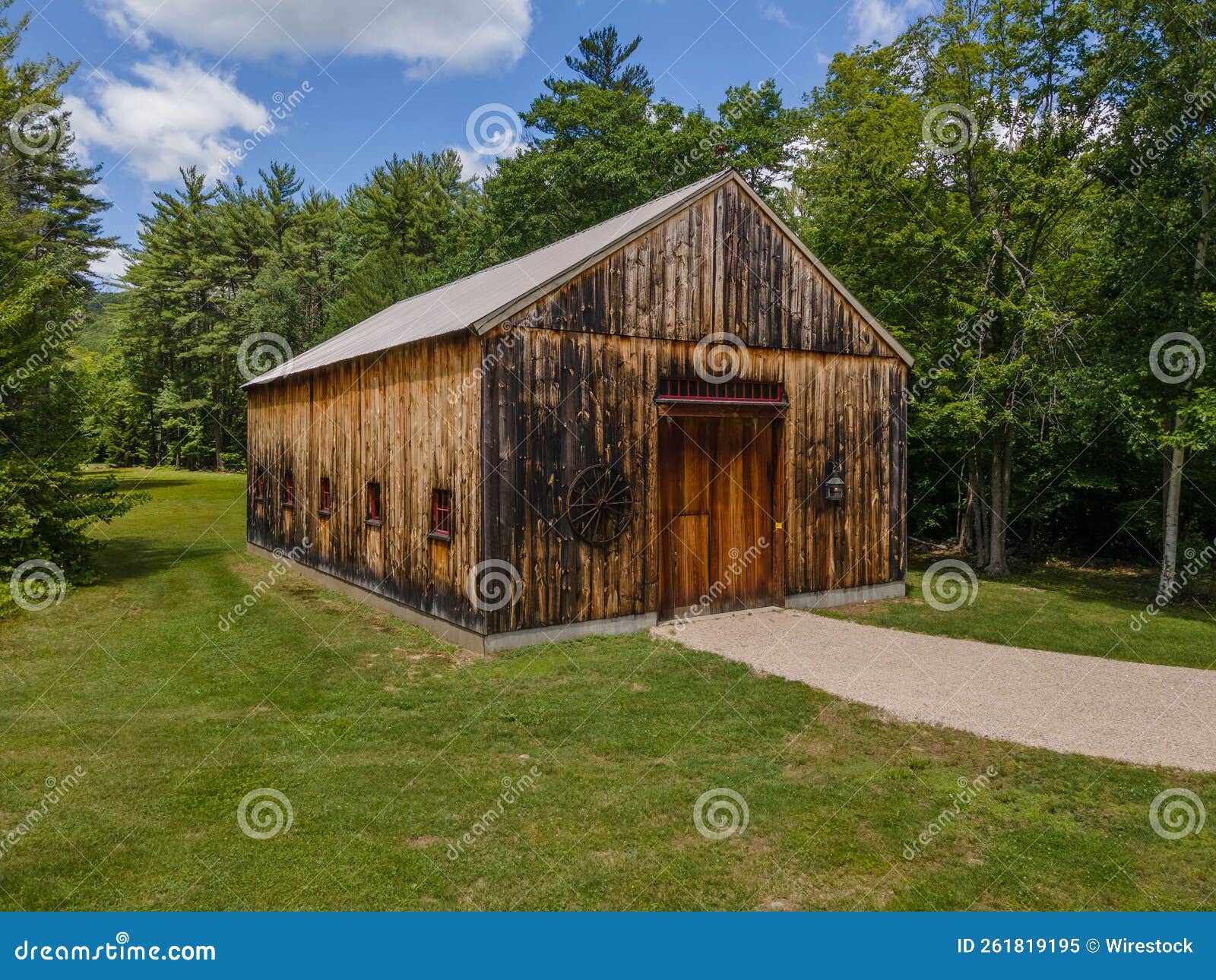 Rustic Cabin Surrounded by Greenery in the Daytime with a Blue Sky and ...