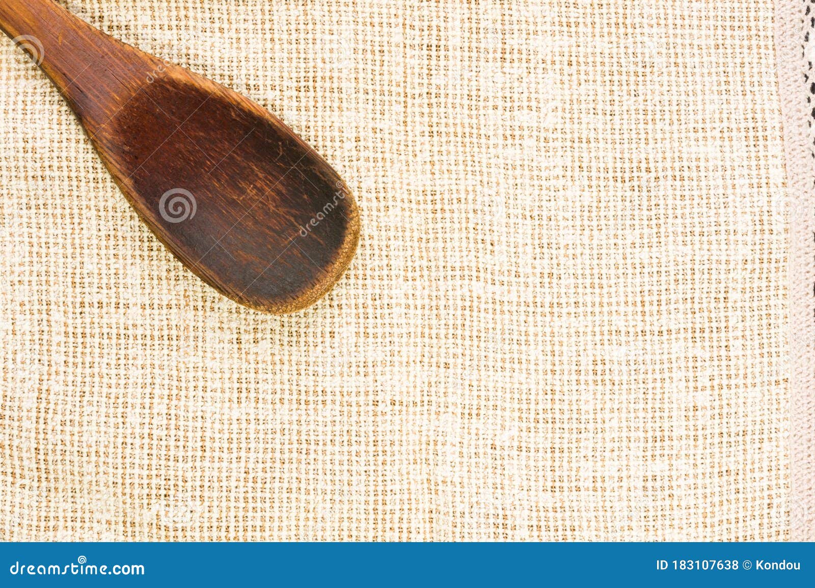 Rustic Coarse Canvas Fabric and a Worn Wooden Spoon, Close-up ...