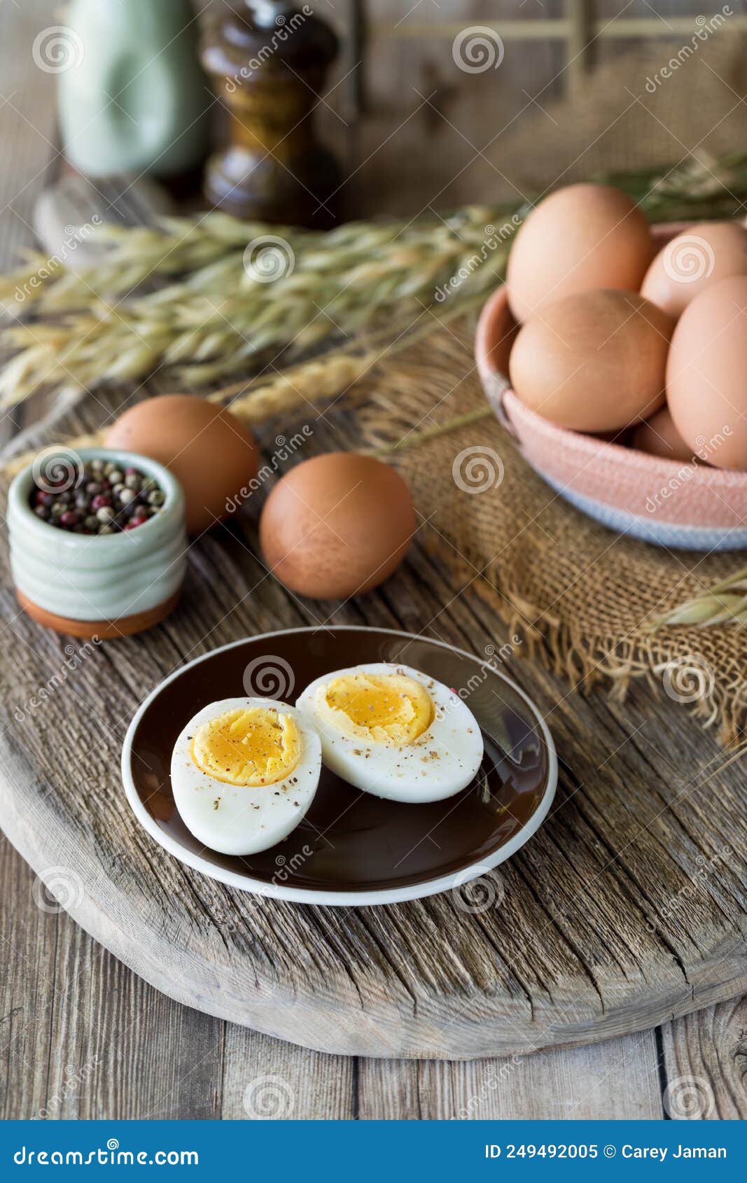 A Rustic Country Scene of Eggs with a Sliced Boiled Egg in Front. Stock ...