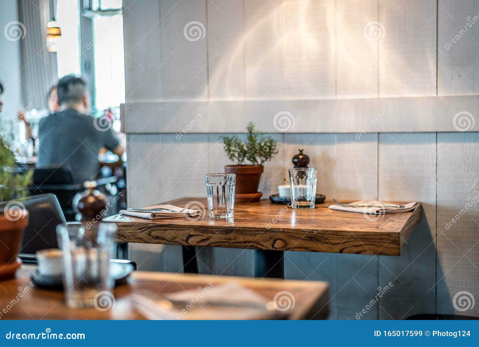 Rustic Country Style Restaurant with White Walls, Table Seating and ...