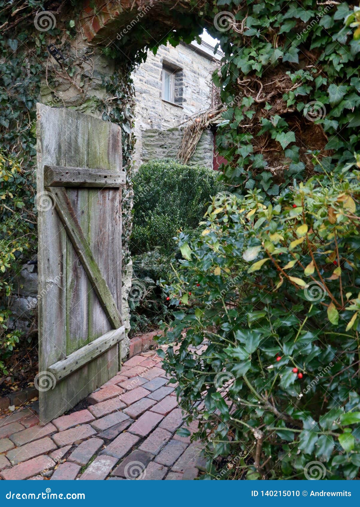 Rustic Courtyard with Wood Gate and Brick Path Stock Photo - Image of ...
