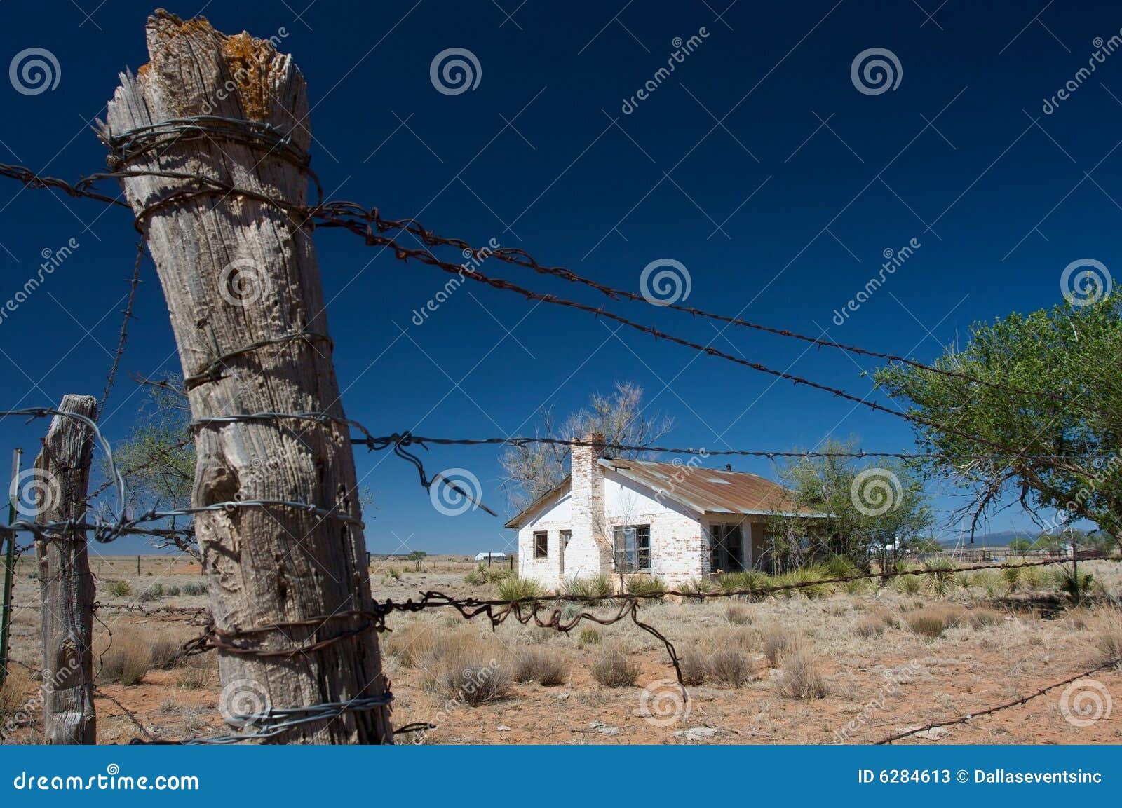 Rustic Home Surrounded by Barbed Wire Stock Image - Image of field ...