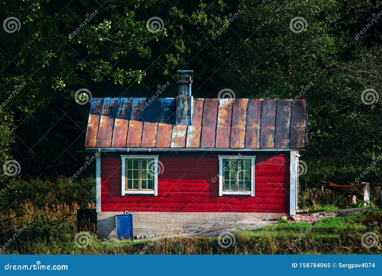 Rustic House with a Rusty Roof on the Edge of the Forest Stock Image ...