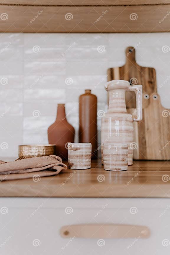 Rustic Kitchen Countertop with a Selection of Ceramic Pots and Bowls on ...