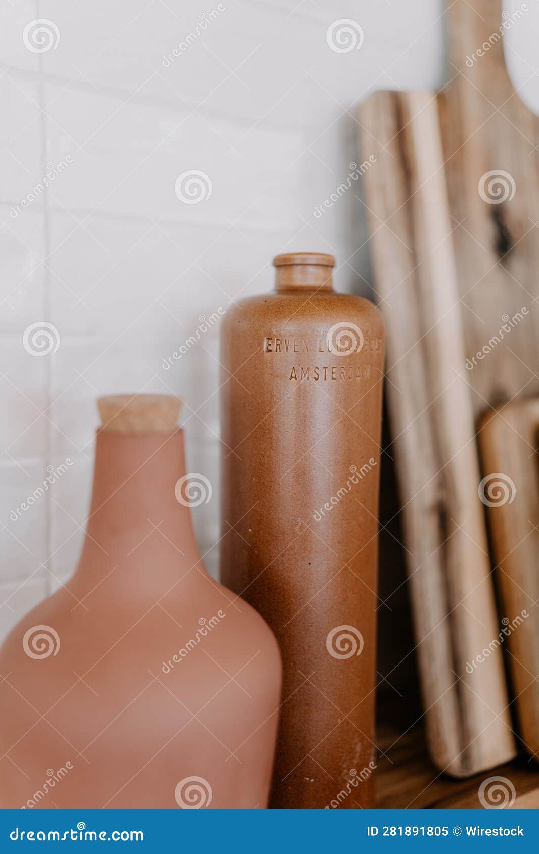 Rustic Kitchen Countertop with a Selection of Ceramic Pots and Bowls on ...
