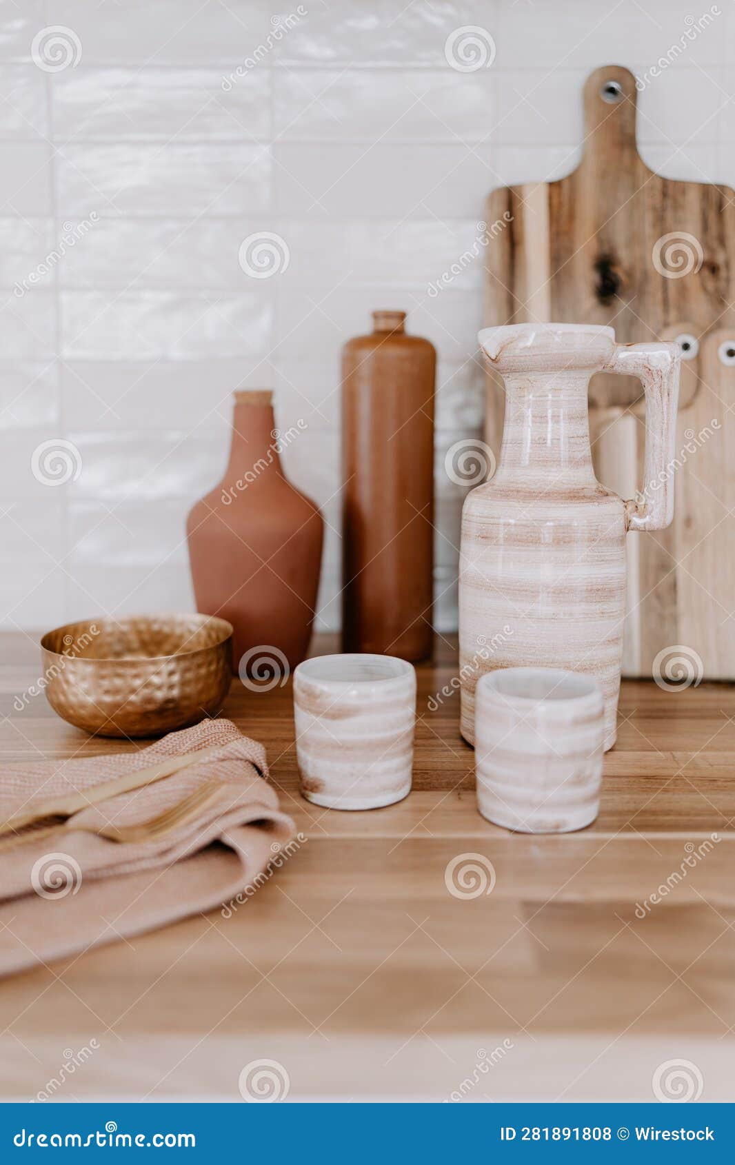 Rustic Kitchen Countertop with a Selection of Ceramic Pots and Bowls on ...