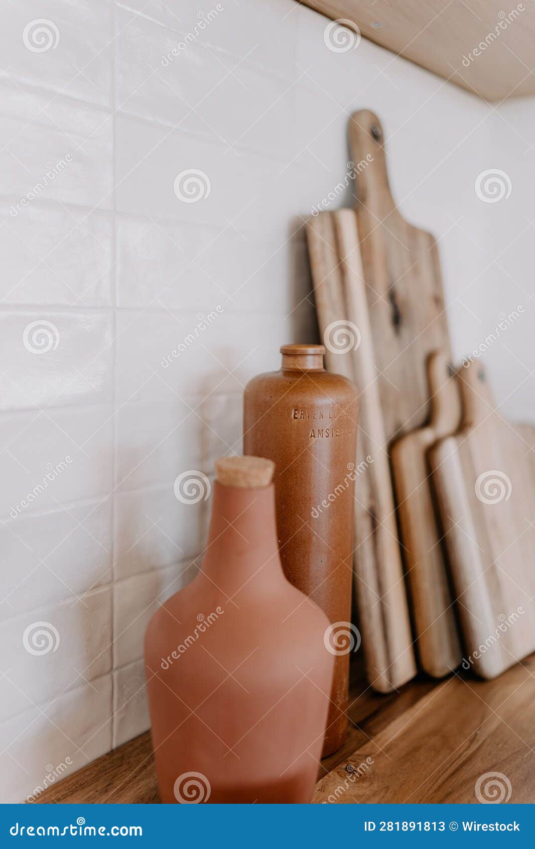 Rustic Kitchen Countertop with a Selection of Ceramic Pots and Bowls on ...