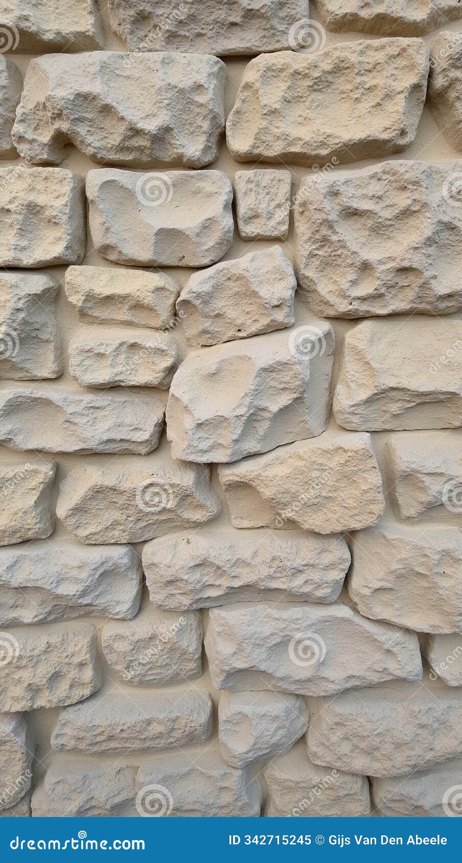 Rustic Limestone Wall in Soft Beige and Gray Hues with Irregular Shapes ...