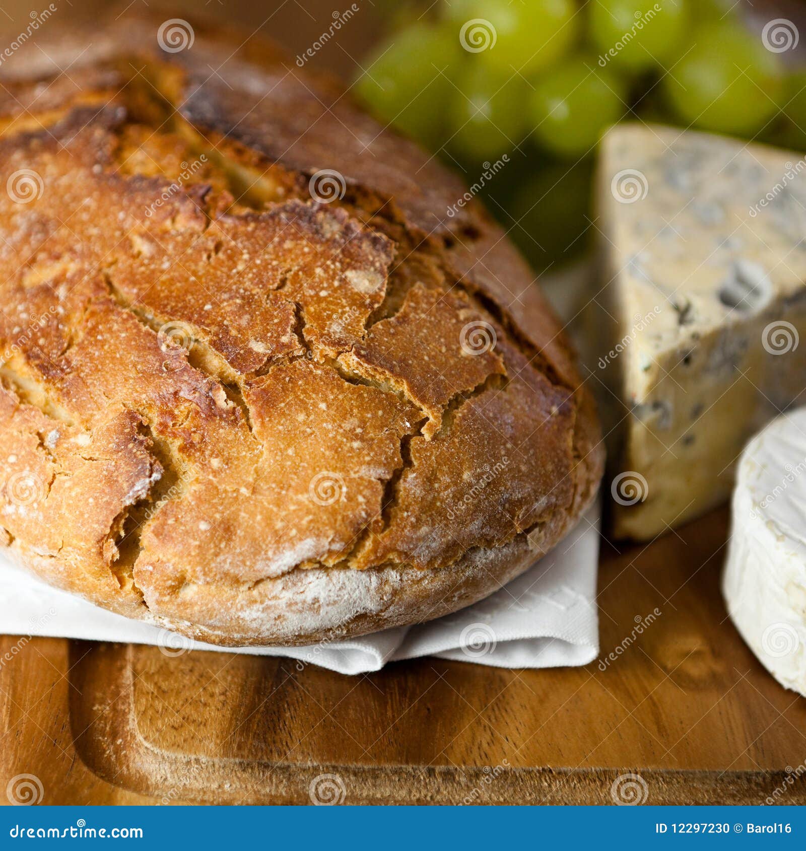 Rustic Loaf of Bread and Cheese Stock Photo - Image of blue, grapes ...