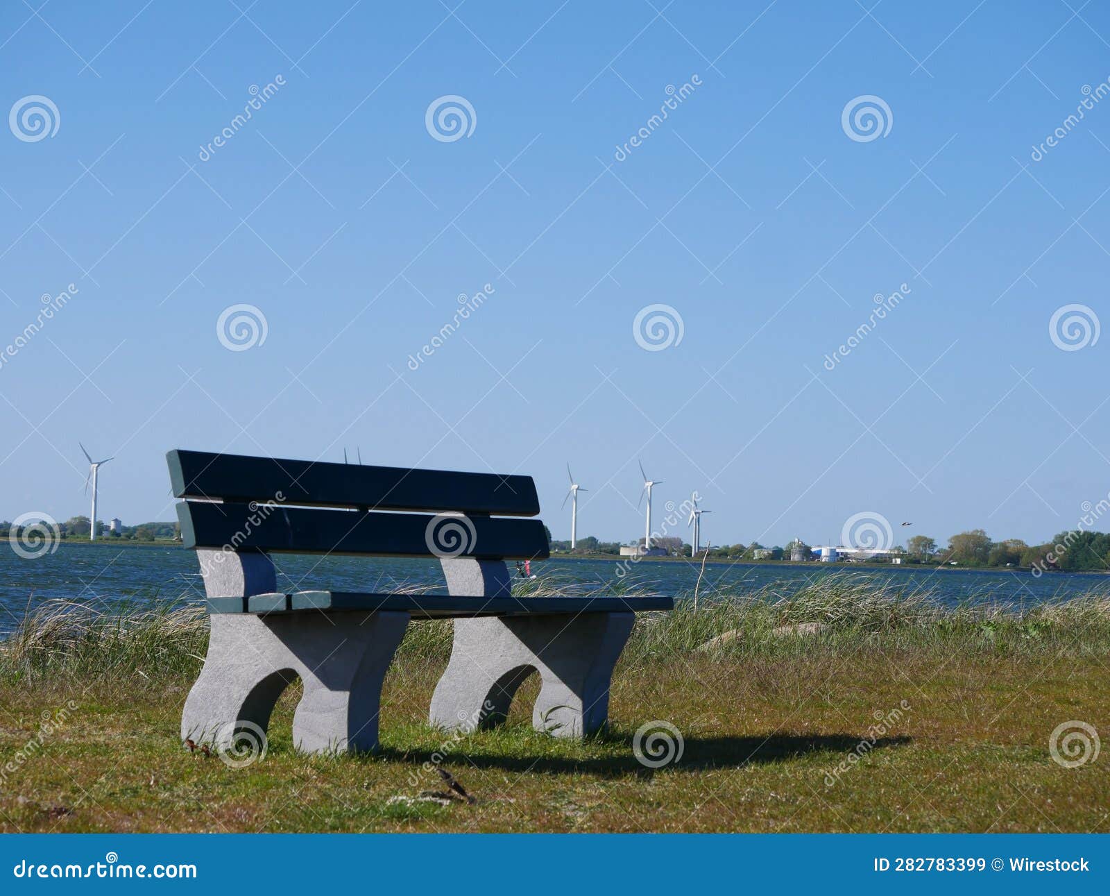 Rustic Park Bench in Front of a Tranquil Beach on the German Island of ...
