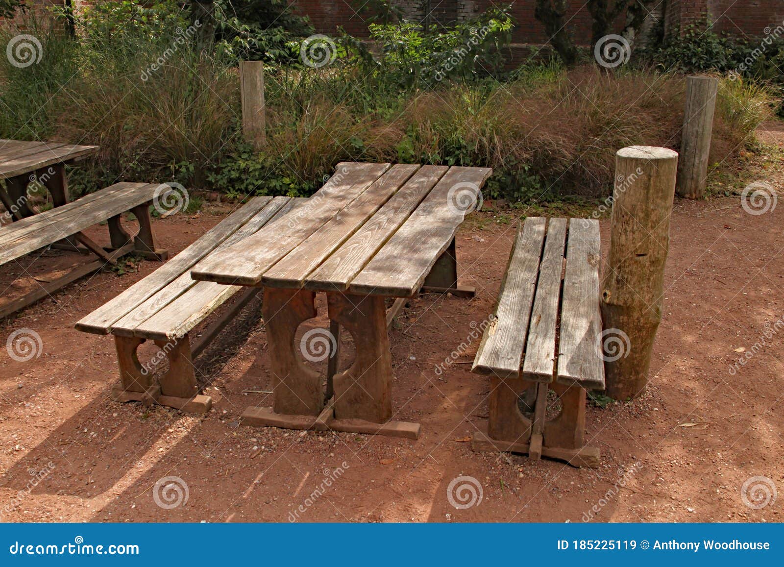 A Rustic Picnic Table and Bench in a Playground Stock Image - Image of ...
