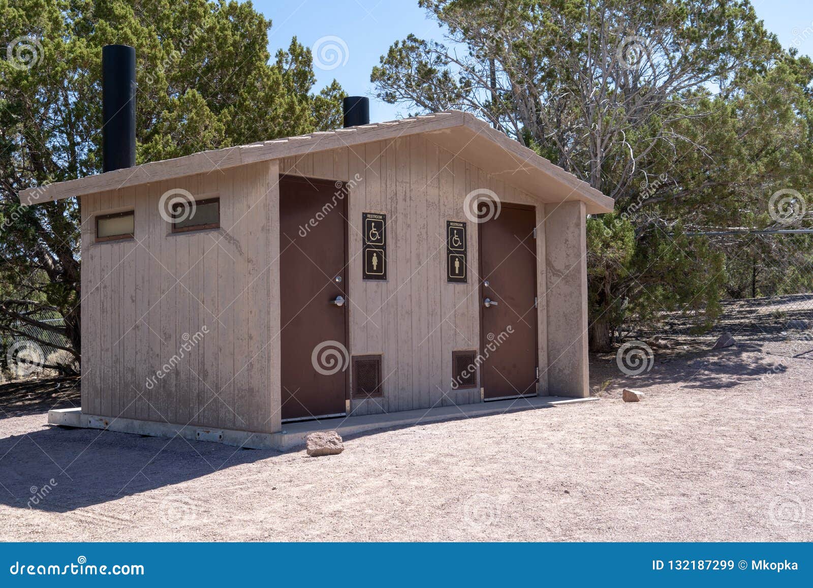 Rustic Pit Toliet Bathrooms Outdoors with Two Stalls on a Sunny Stock ...