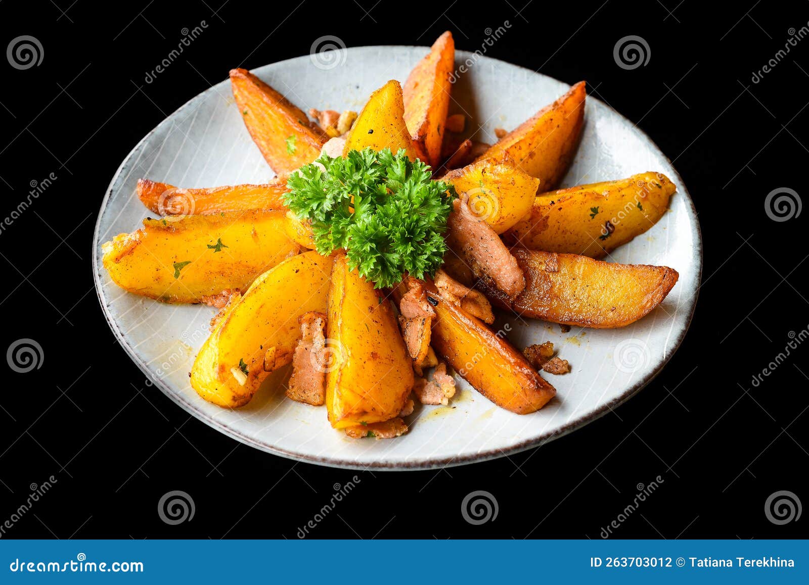Rustic Potato Wedges with Bacon on Black Background Side View Stock ...