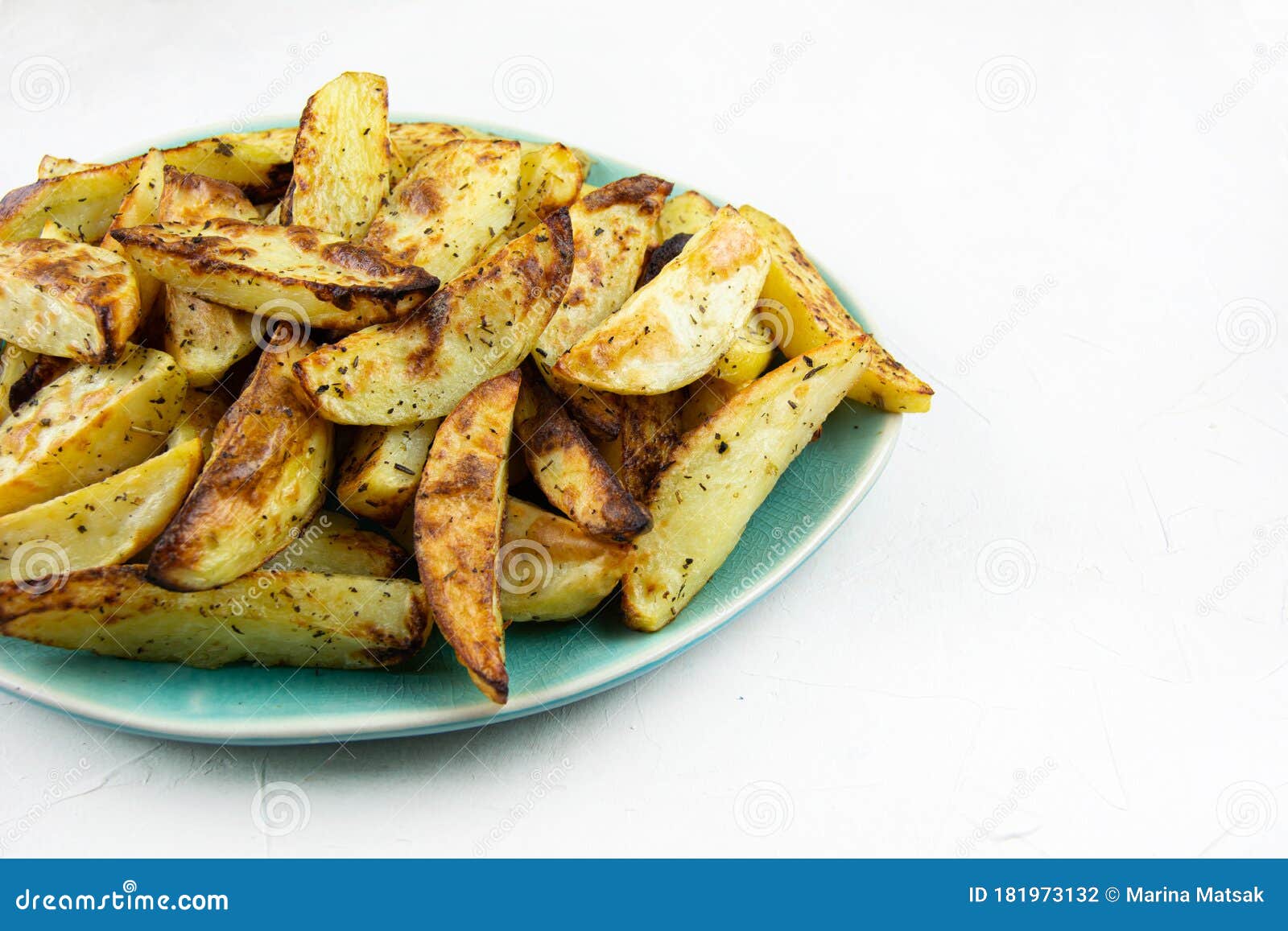 Rustic Potatoes on a Blue Plate. White Background Stock Photo - Image ...