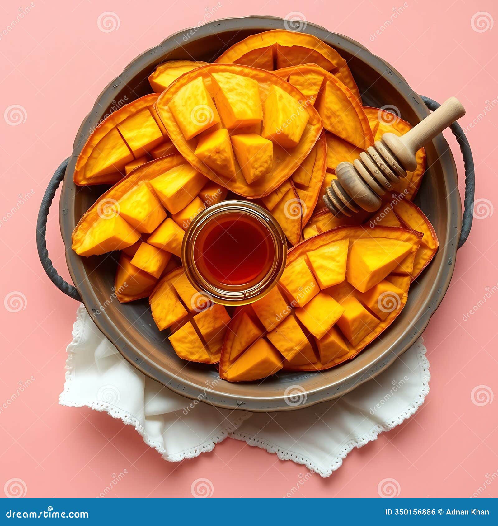 A Rustic Setup of Dried Mango Slices with a Small Jar of Honey on a ...
