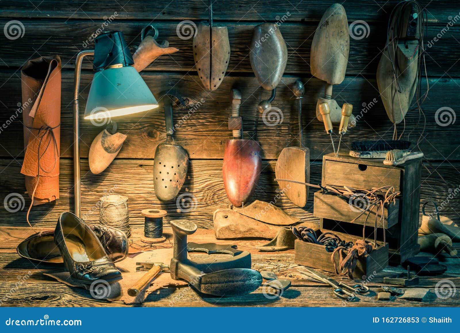 Rustic Shoemaker Workshop with Shoes To Repair and Tools Stock Image ...