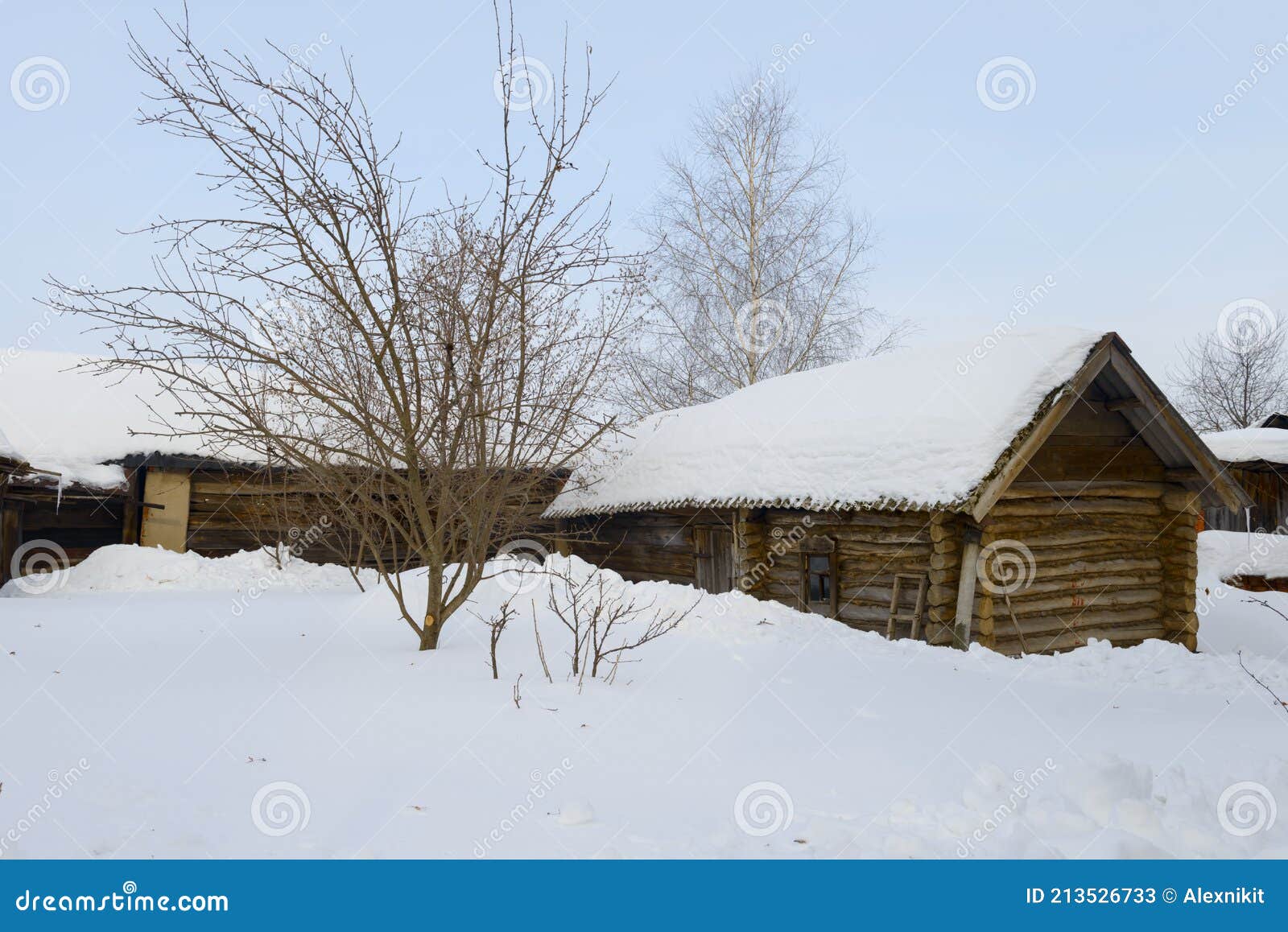 Rustic Snow-covered Courtyard with Log Buildings Stock Image - Image of ...