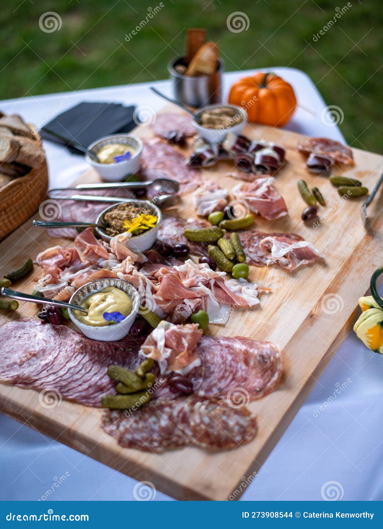 Rustic Spread of Cured Meats and Pickles on a Cutting Board with a ...