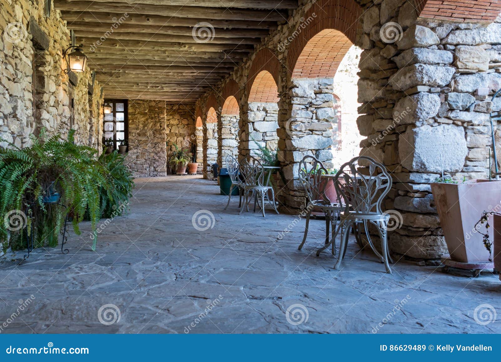Rustic Stone Patio stock image. Image of tables, terrace - 86629489