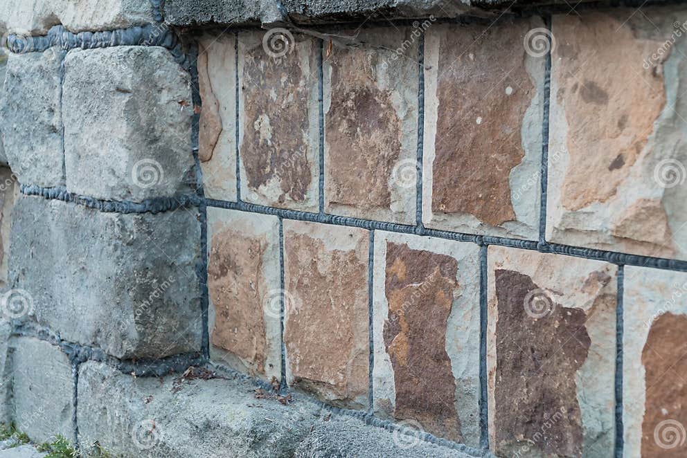 A Rustic Stone Wall with Textured Blocks and Subtle Color Variation ...