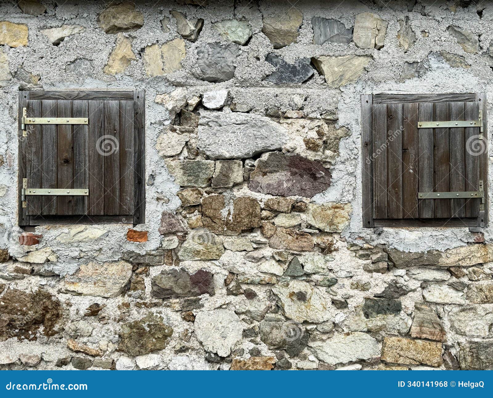 Rustic Stone Wall with Wooden Shutters: Texture and Architecture in ...