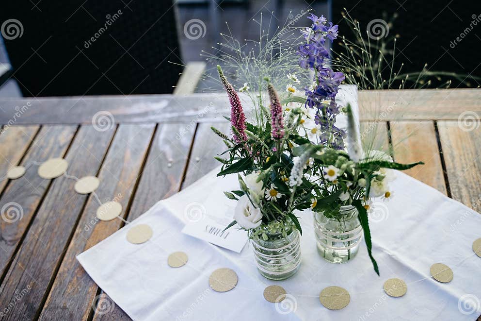 Rustic Table Setting with Wildflowers Stock Photo - Image of charm ...