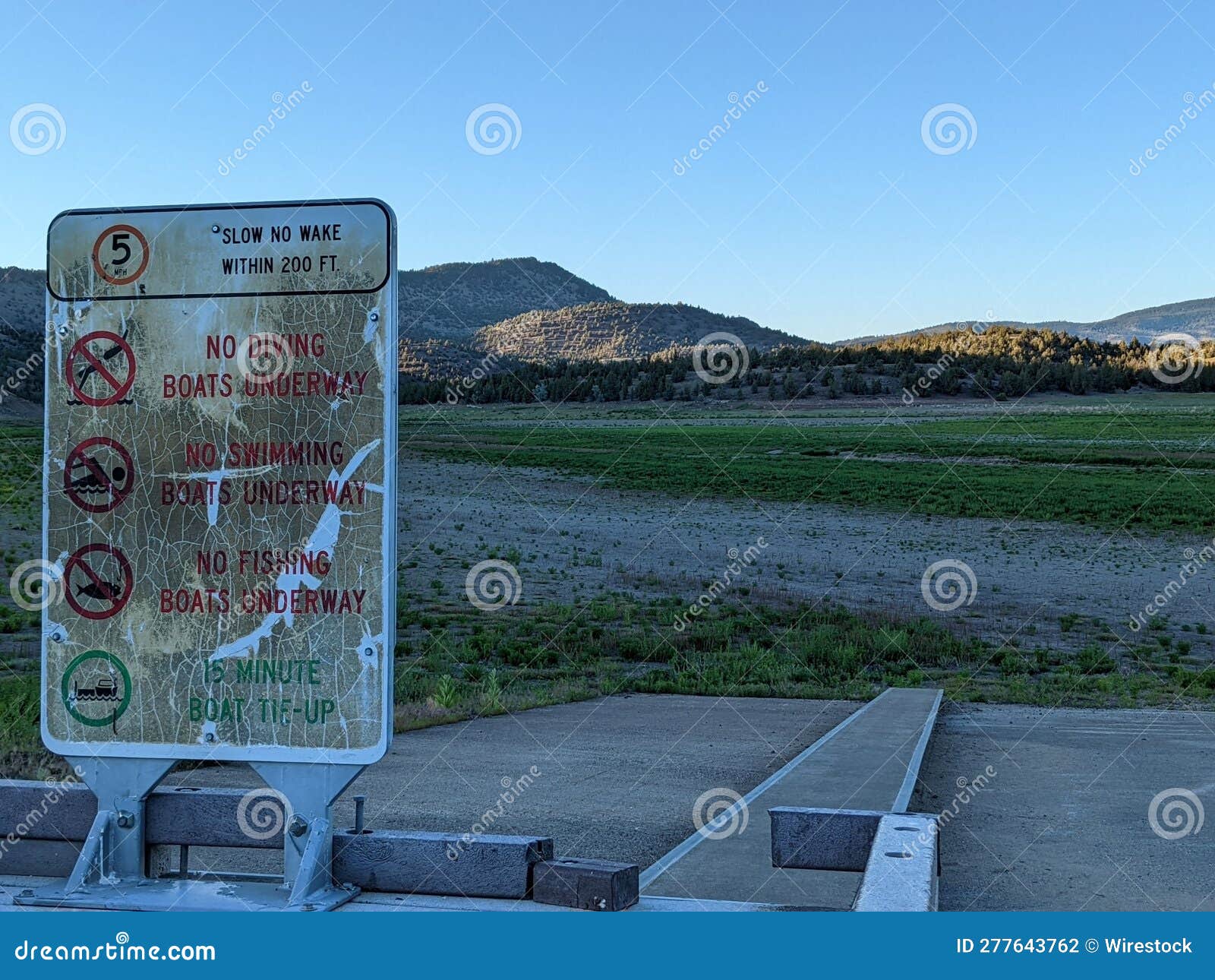 Rustic Warning Sign with a Breathtaking Landscape in the Background ...