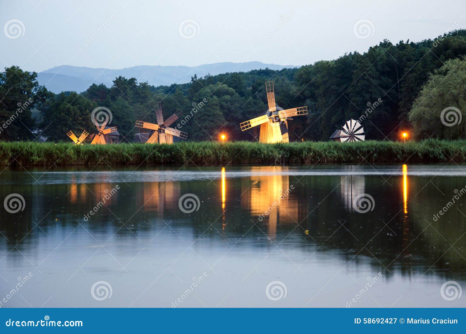 Rustic windmills by night stock image. Image of field - 58692427