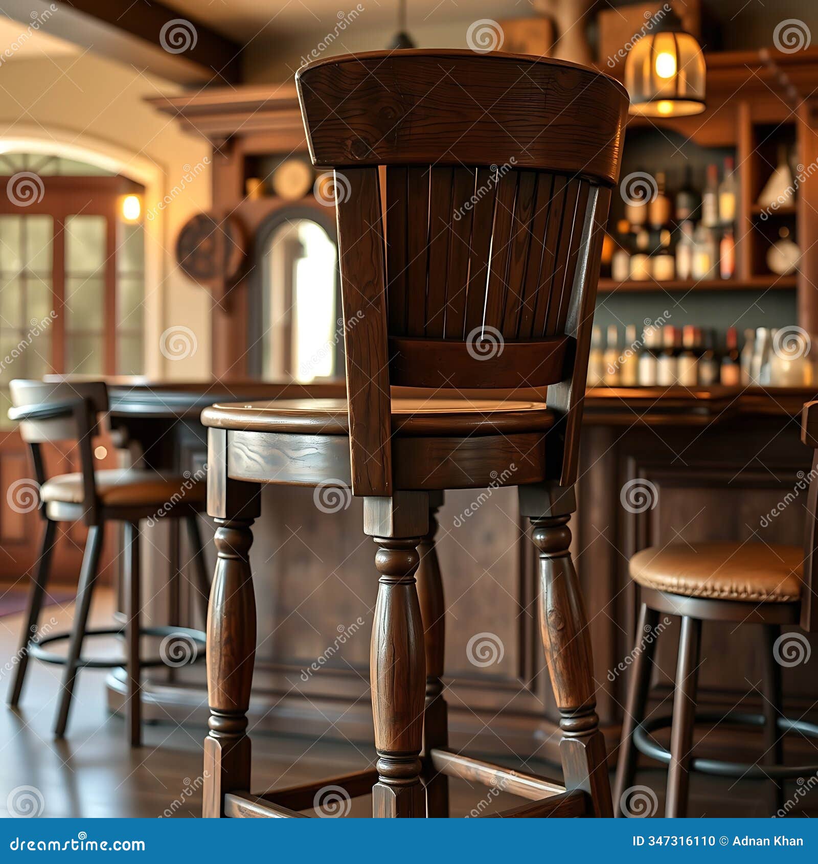 A Rustic Wooden Bar Stool with a High Backrest Positioned in Front of a ...