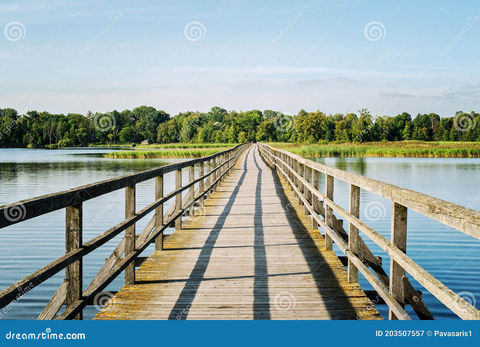 Rustic Wooden Bridge Leading Across a Wide River Stock Image - Image of ...