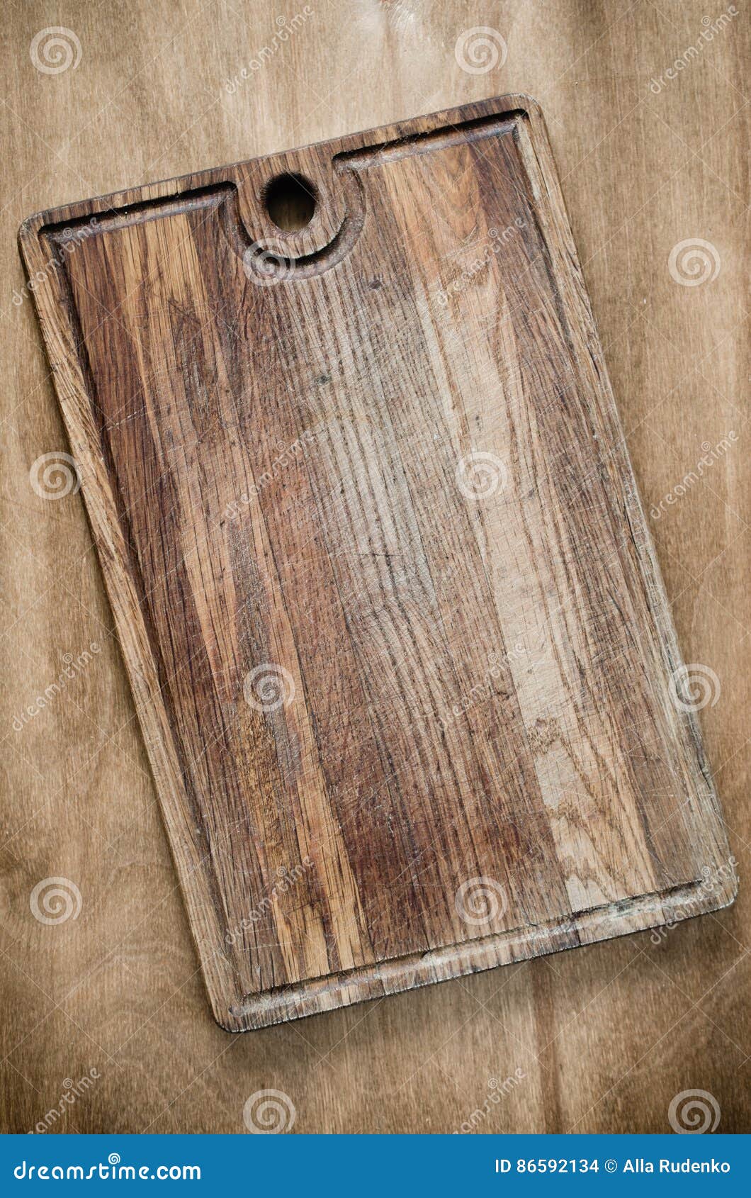 Rustic Wooden Cutting Board on Wooden Background. Stock Photo - Image ...