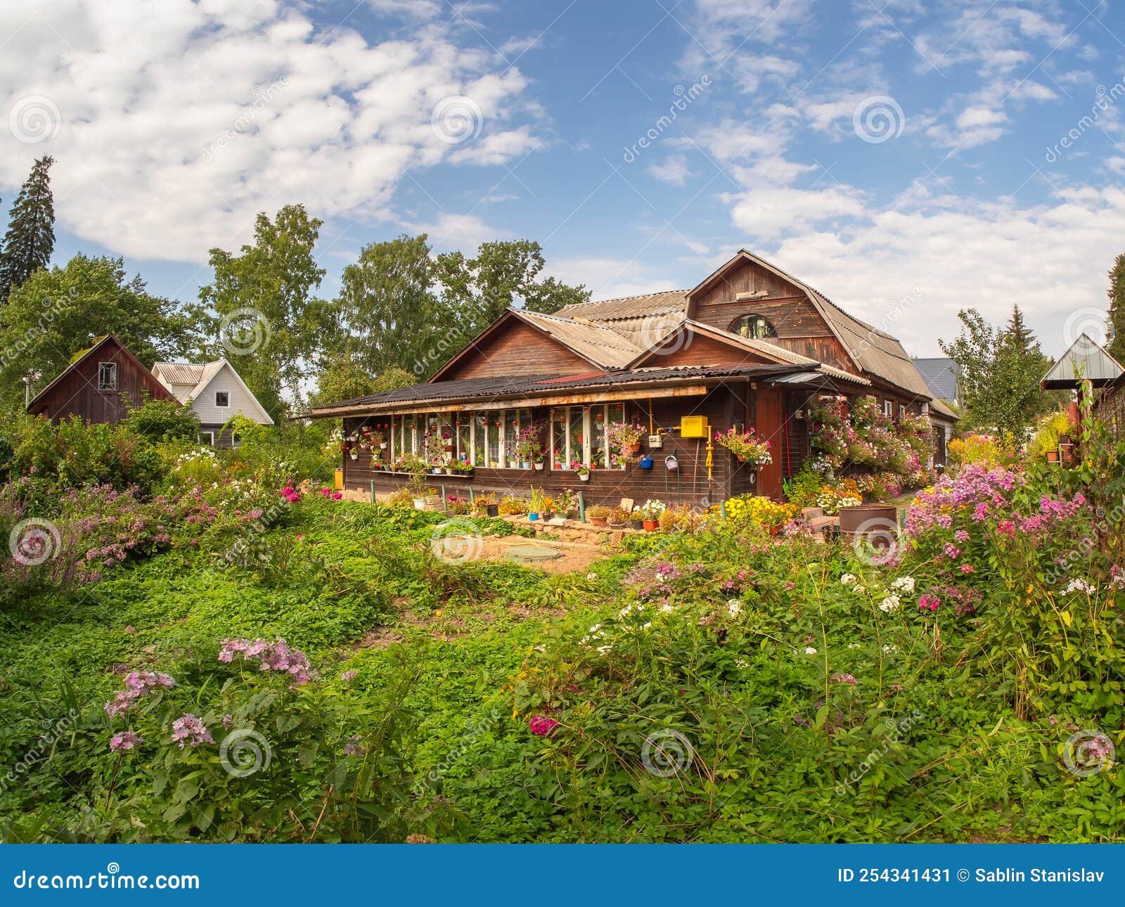 Rustic Wooden House with a Flower Garden. Old Wooden House Stock Image ...