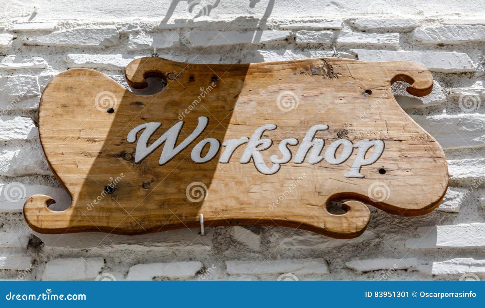 Rustic Wooden Signboard with the Word Workshop on a White Wall Stock ...