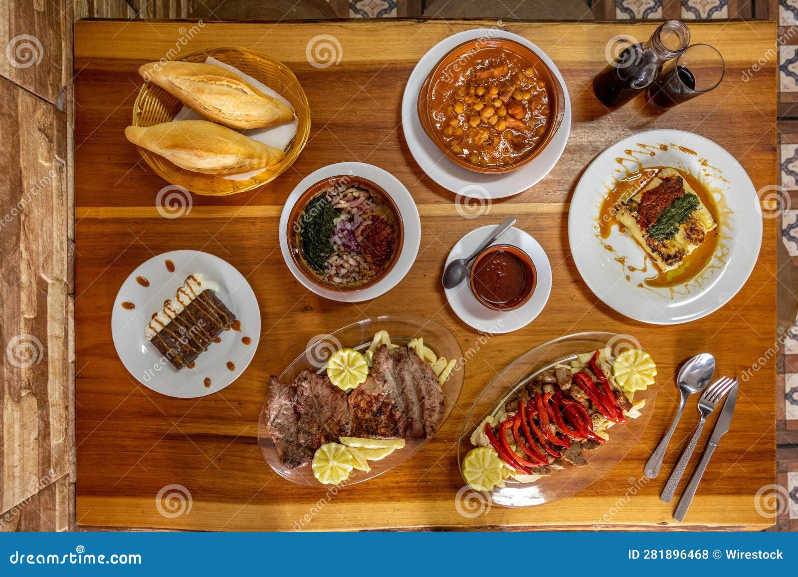 Rustic Wooden Table Displaying a Selection of Delicious Dinner Food on ...