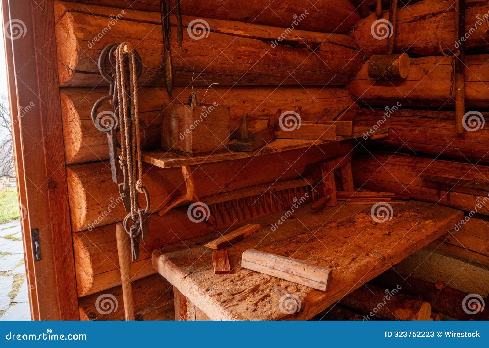 A Rustic Wooden Workshop with Various Tools and Equipment Inside a Log ...