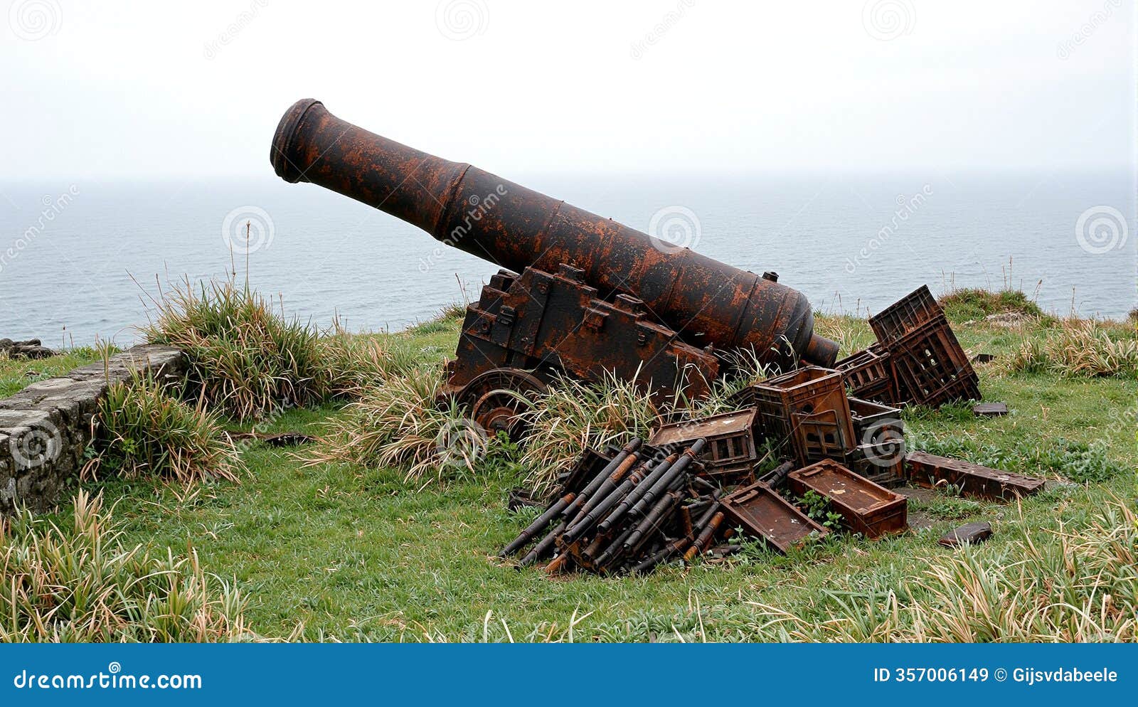 Rusting Battleship Cannon on Cliff Edge Amidst Overgrown Grass and ...